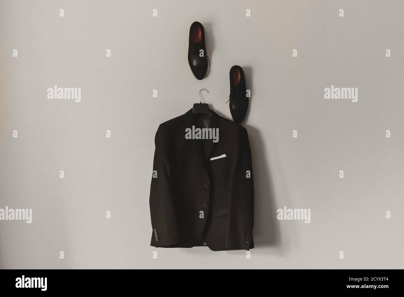 Hanging groom suit hi-res stock photography and images - Alamy