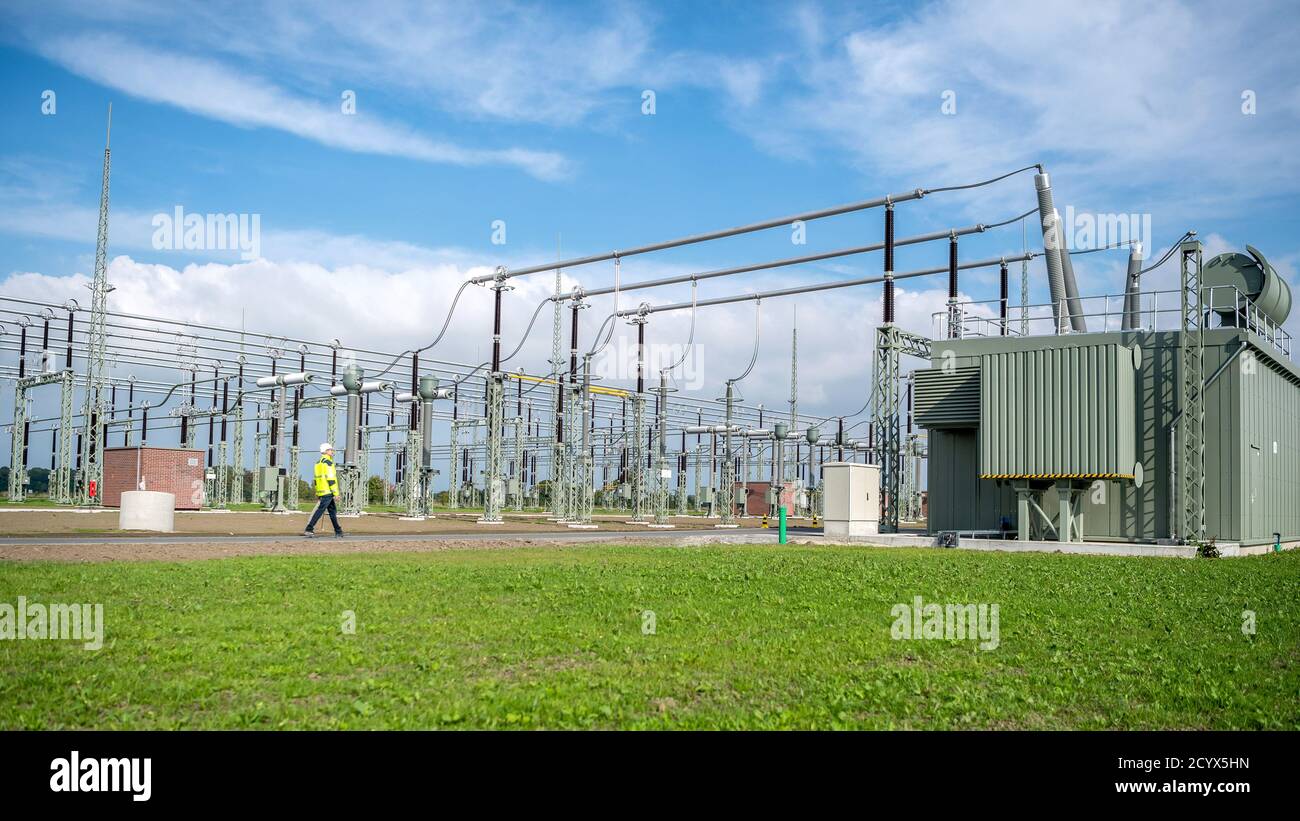 Wilhelmshaven, Germany. 02nd Oct, 2020. An employee walks through the new substation ...