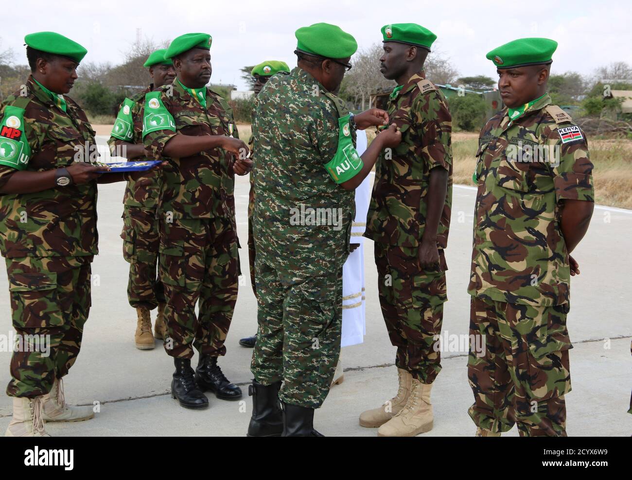 AMISOM Force Commander Lt. Gen. Jim Beesigye Owoyesigire presented ...