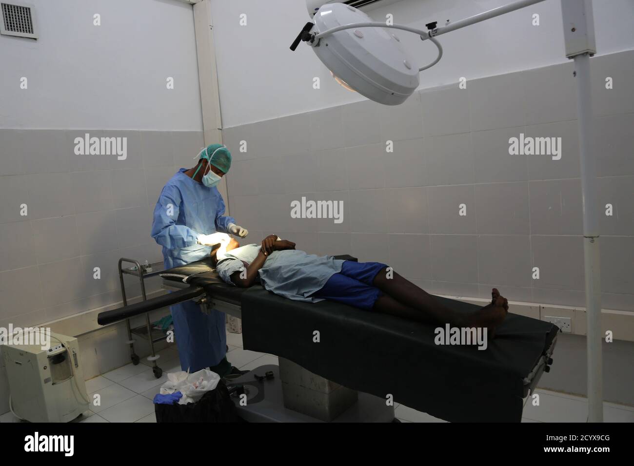 A surgeon performs cleft lip and palate surgery on a patient at the ...