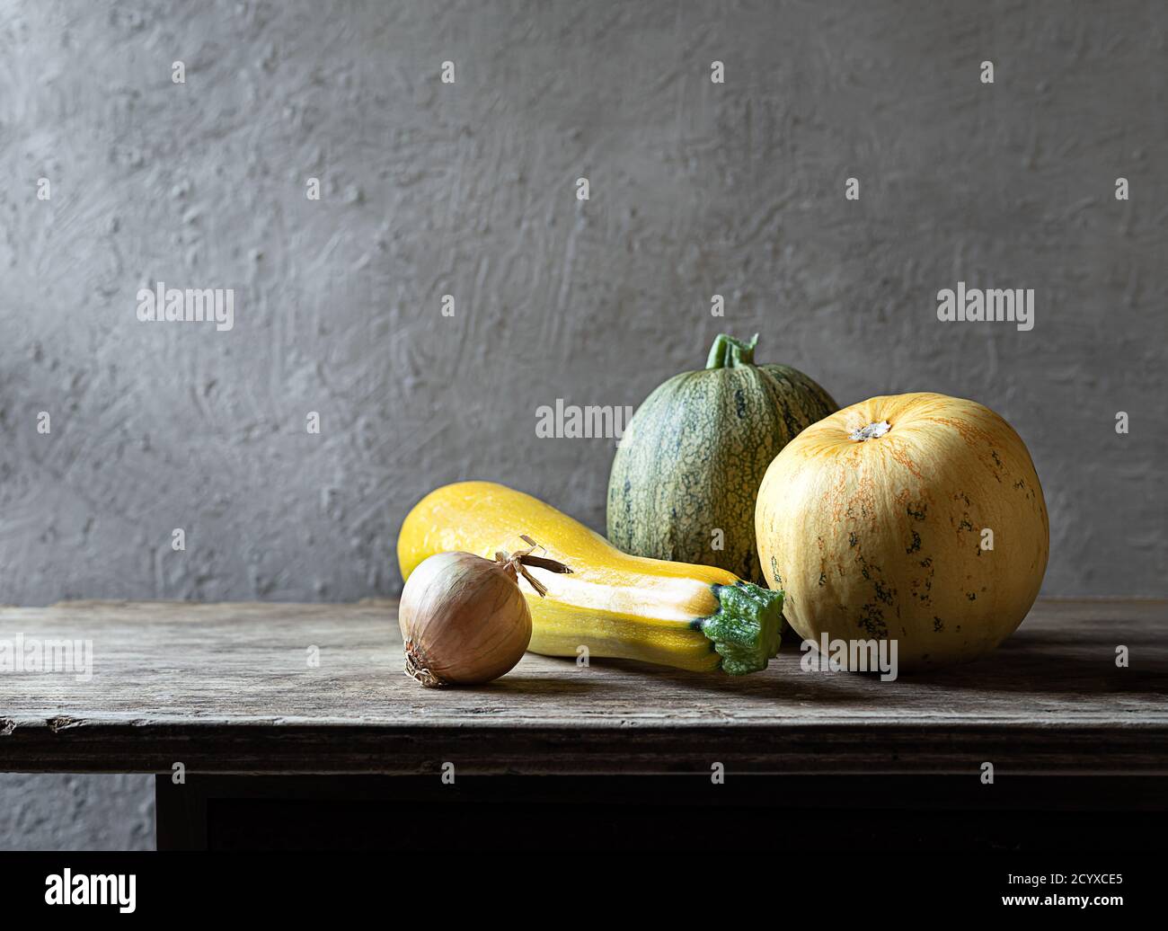 Organic fresh vegetables - yellow zucchini, round zucchini, onion on ...