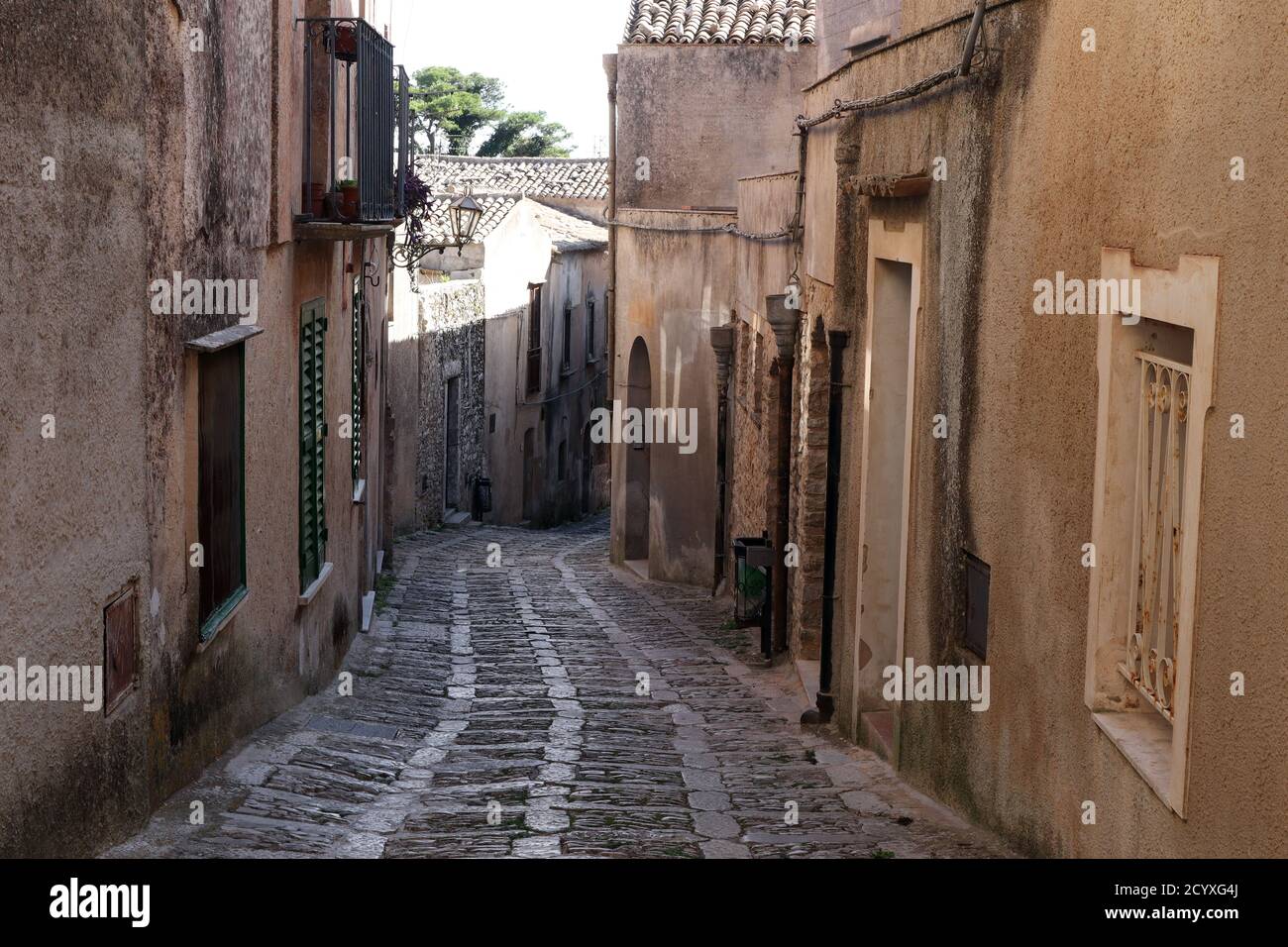 Beautiful cobbled street in ancient town of Erice, Sicily Stock Photo ...