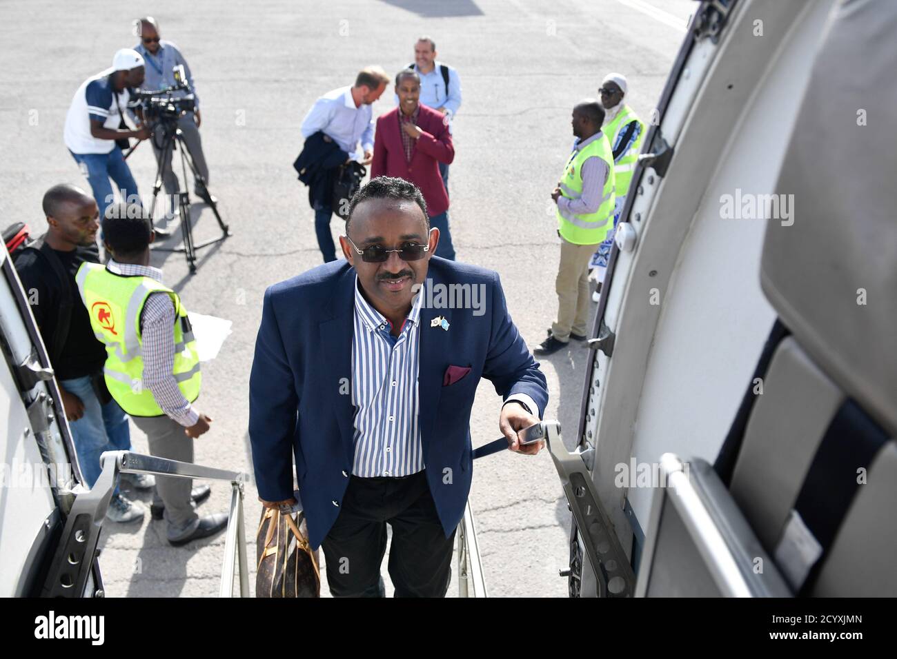 On December 18, 2018, a passenger boards Kenya Airways at Adan Adde ...