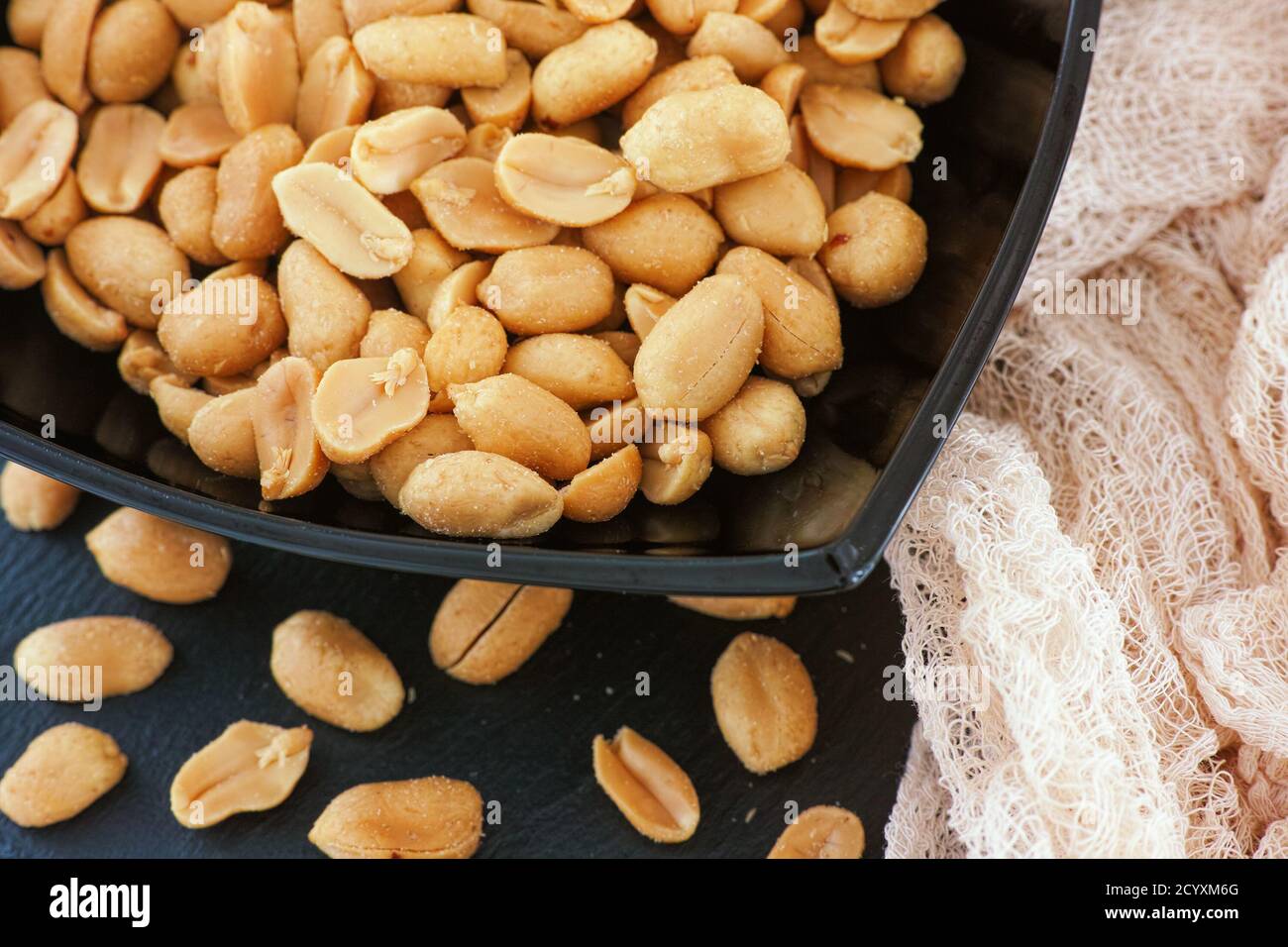 Salted roasted peanuts. Close up Stock Photo - Alamy