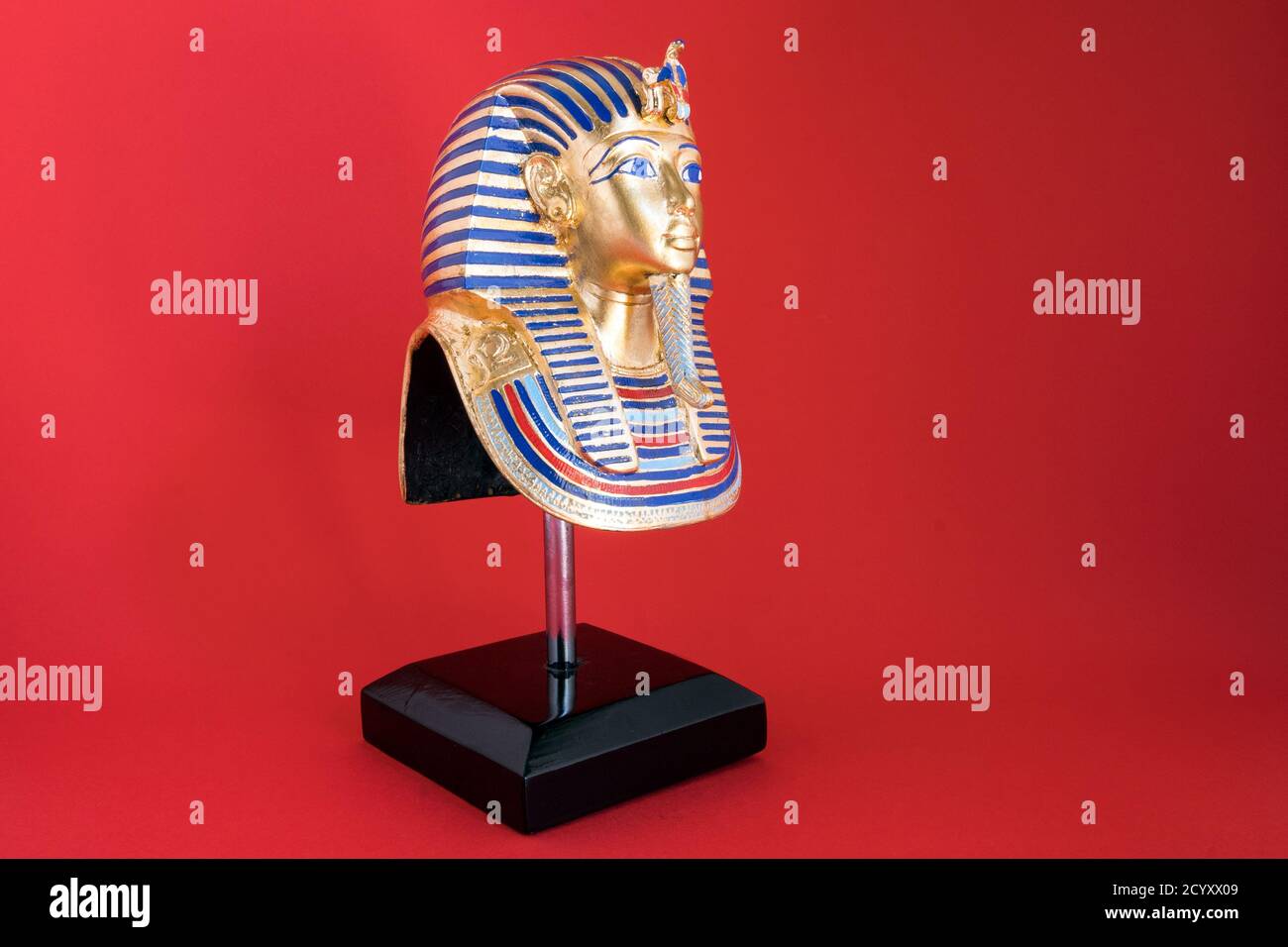 Beautiful handmade golden pharaohs mask of tutankhamun over a red ...