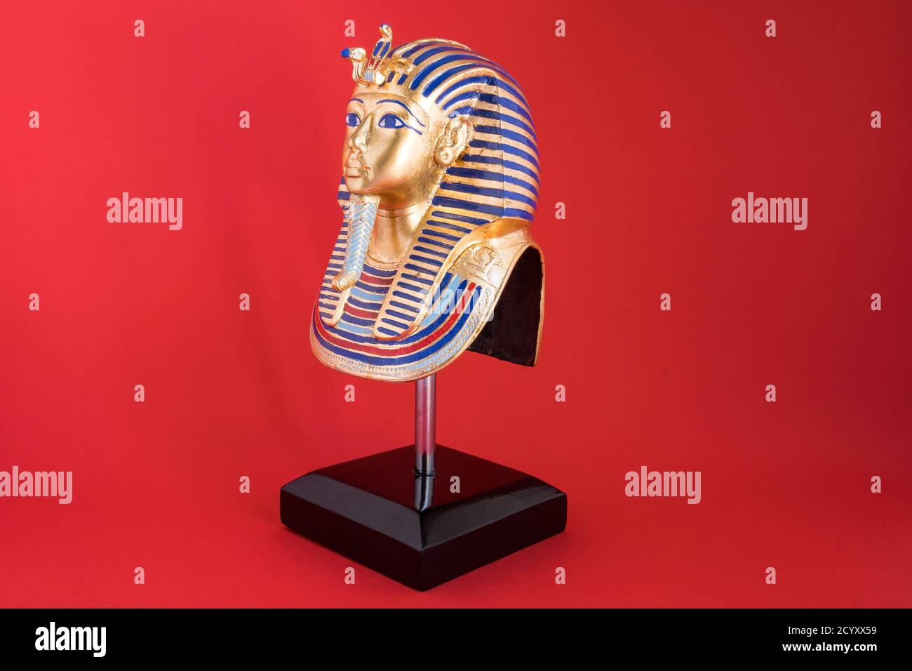 Beautiful handmade golden pharaohs mask of tutankhamun over a red ...