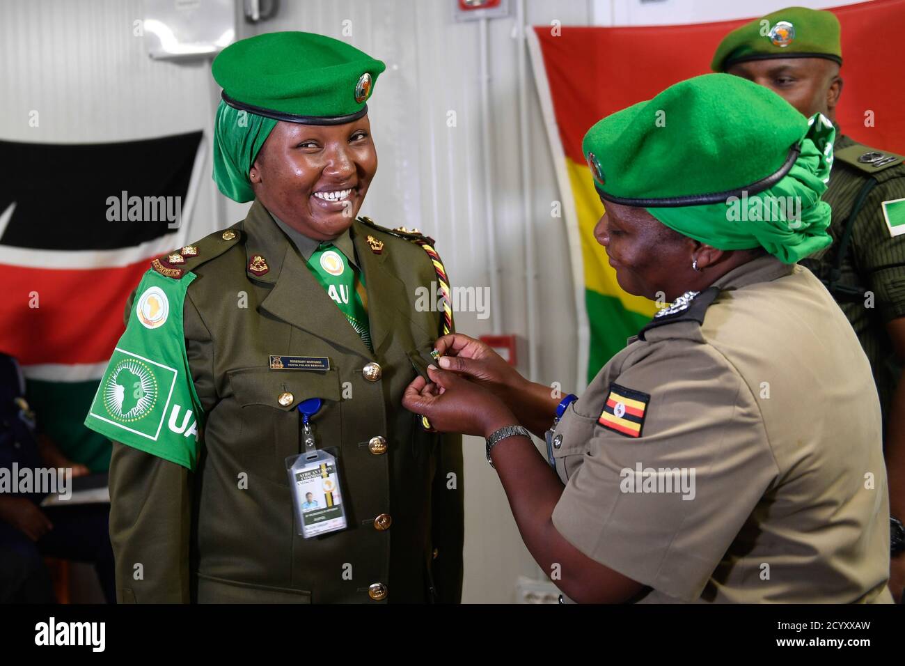Christine Alalo, acting AMISOM Police Commissioner, presents medals to ...