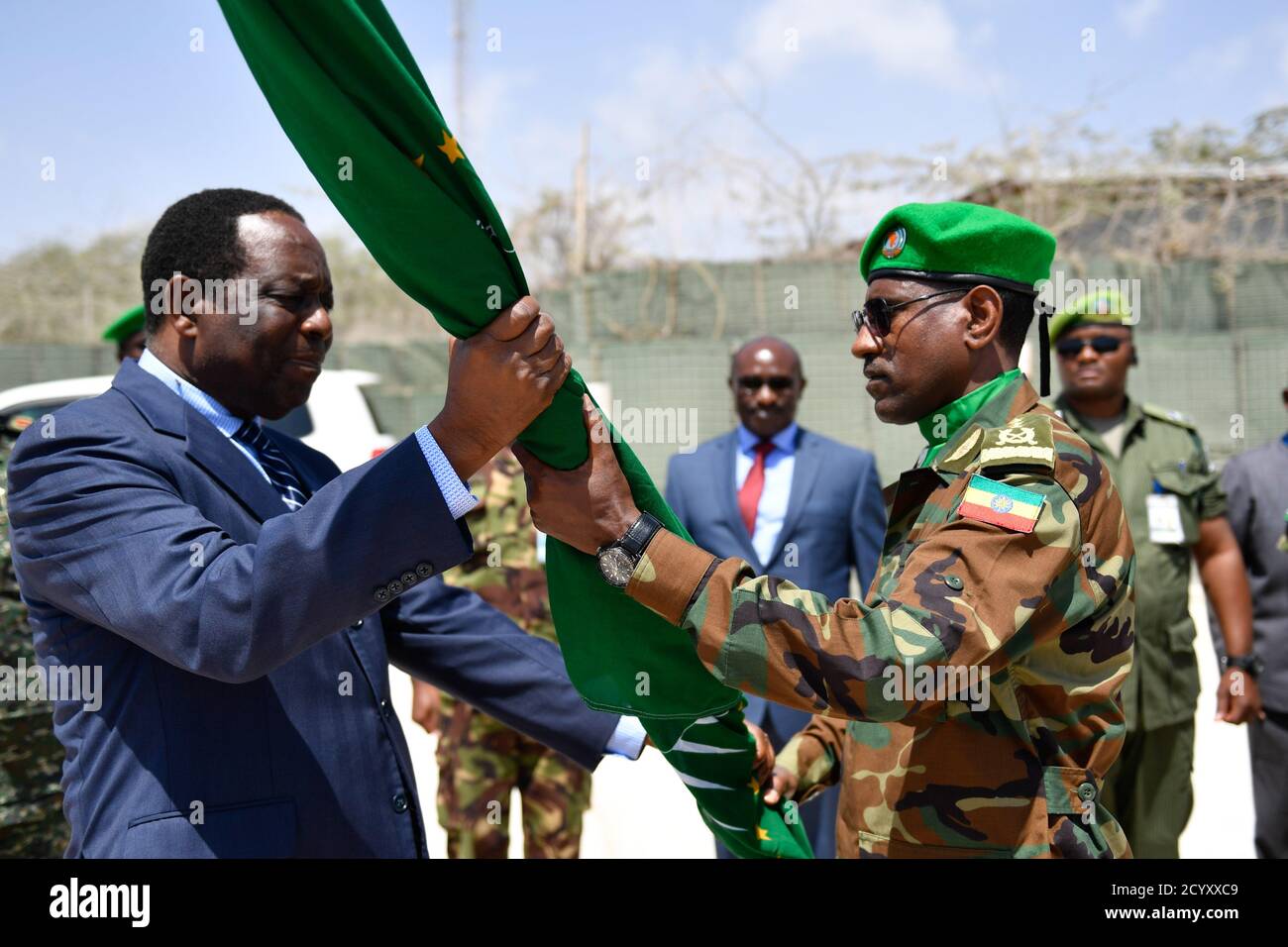 Ambassador Francisco Madeira presents the African Union flag to Lt. Gen ...