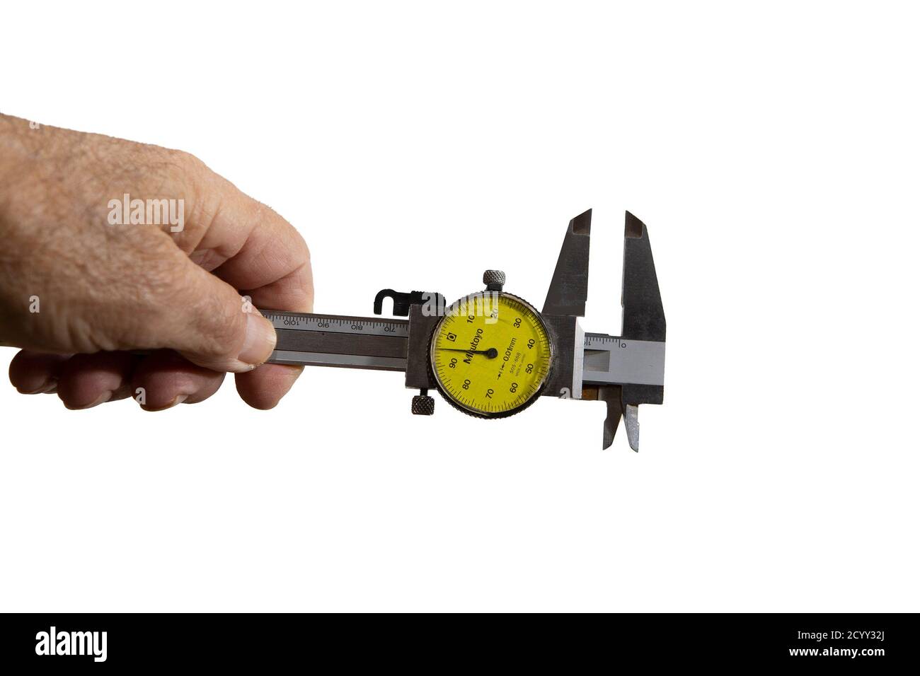 A worker's hand holds a caliper with millimeter adjustment Stock Photo ...