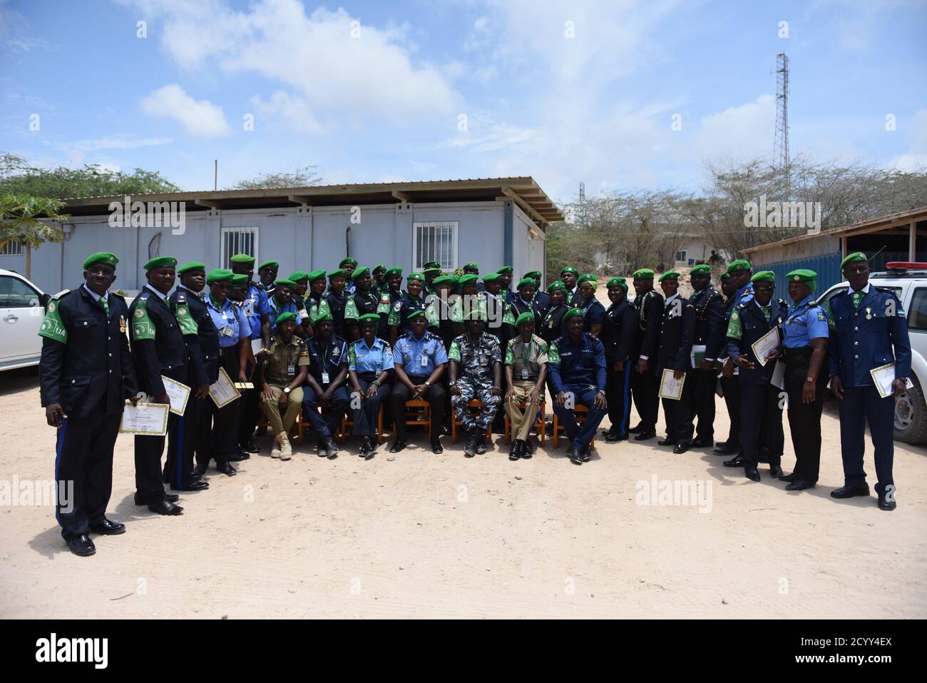 AMISOM Police Chief of Staff, Rex Dundun, poses for a group photograph ...