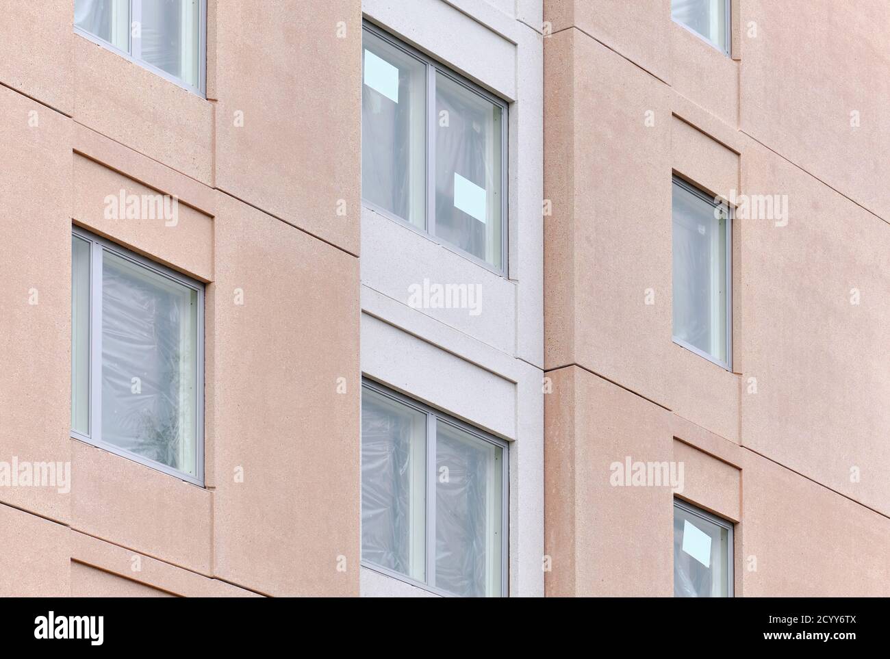 The modern pink facade of the apartment building in Finland. The modern ...