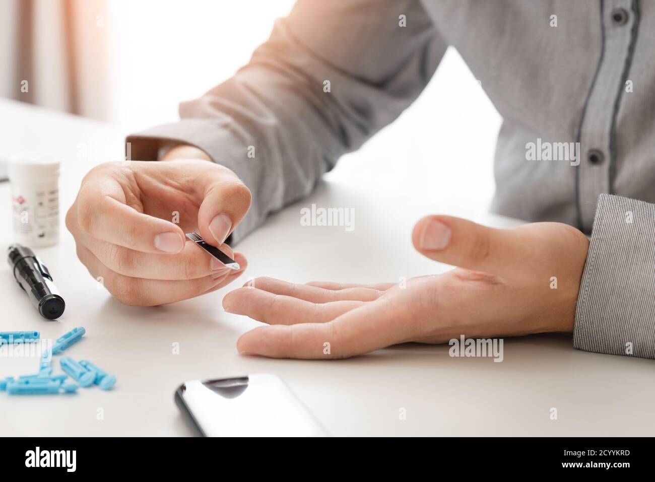 Checking blood sugar level glucometer hi-res stock photography and ...
