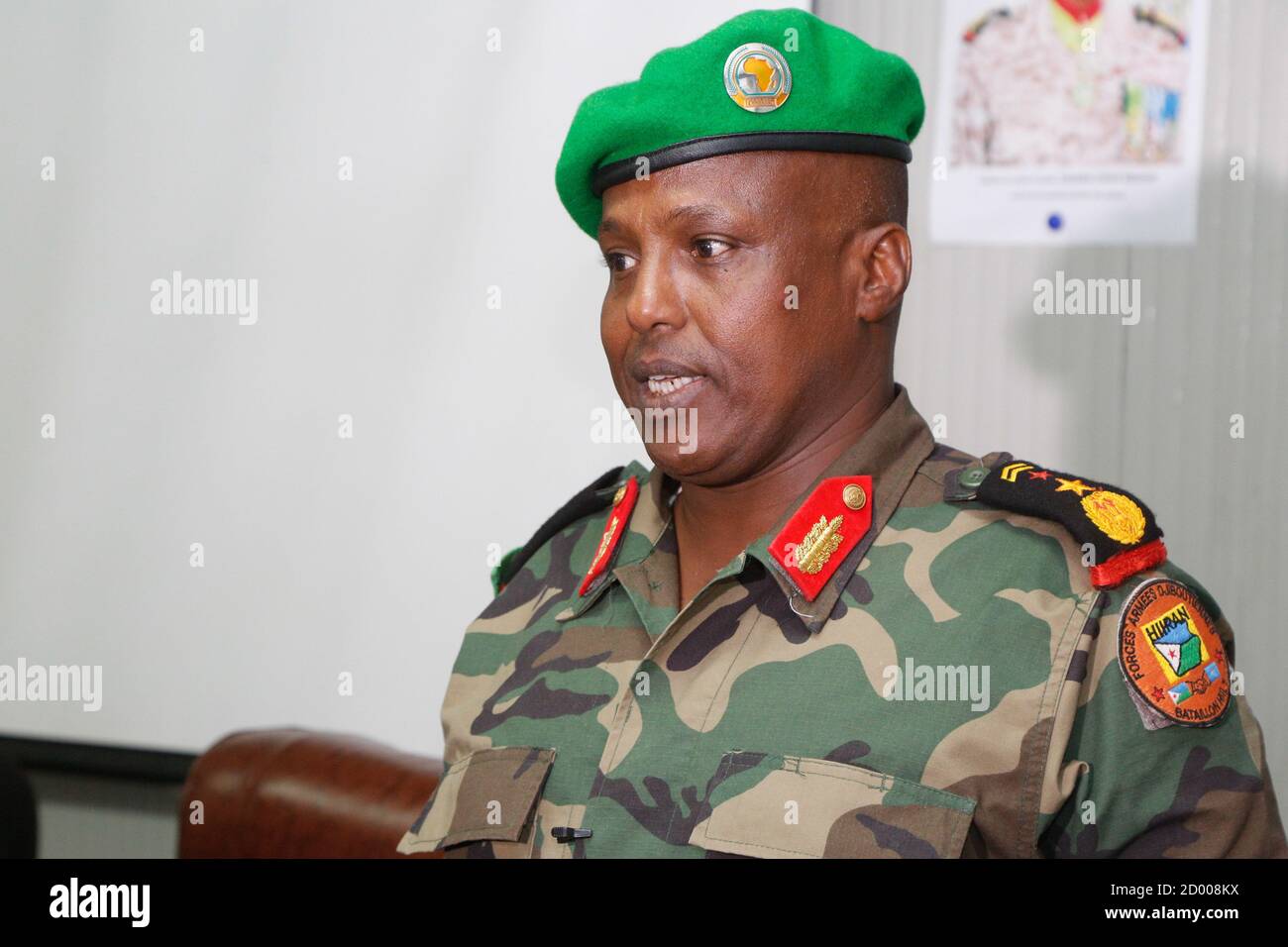 Col. Abdullahi Muse Omar (left), the incoming Commander of the ...
