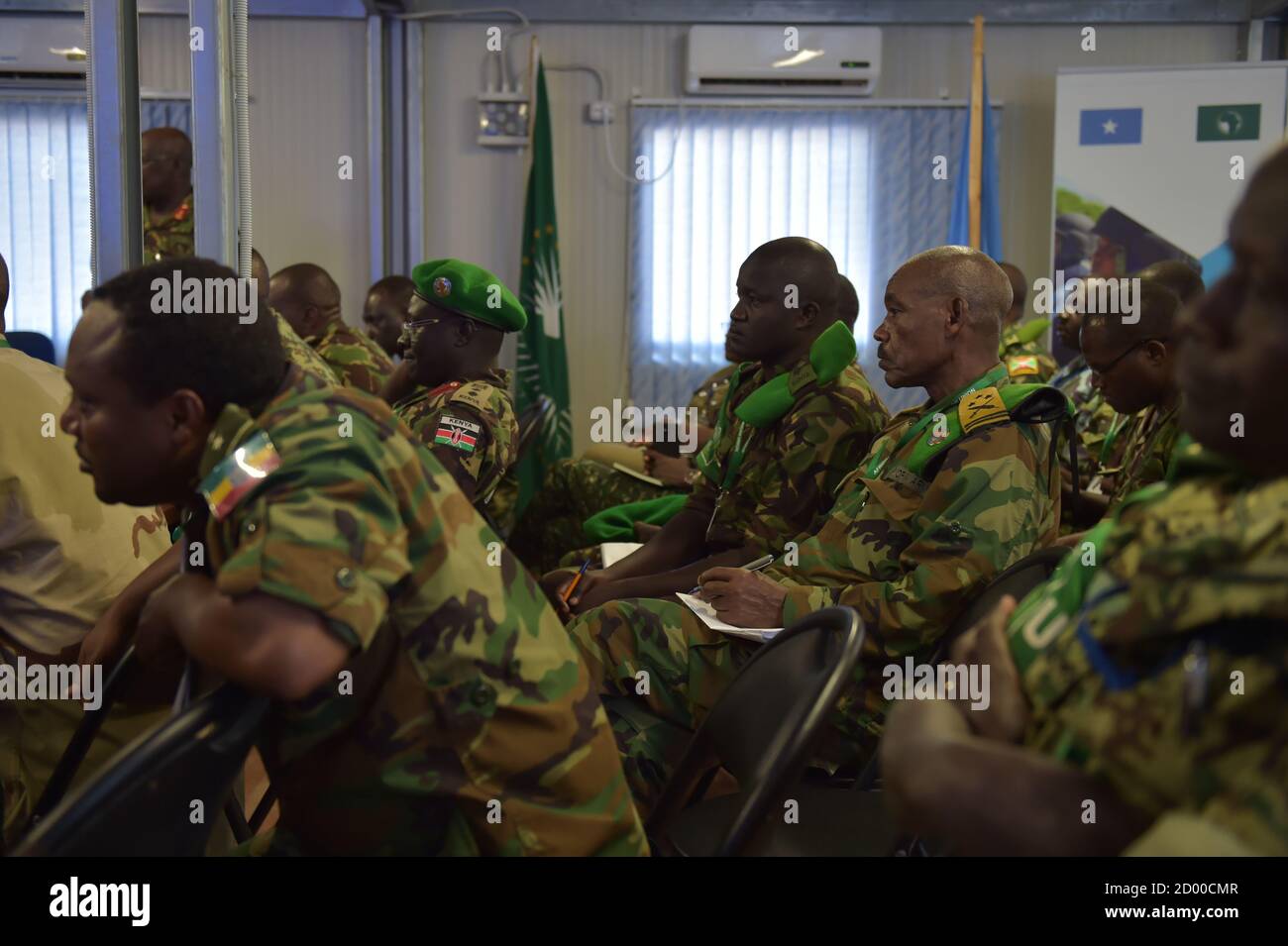 Soldiers belonging to AMISOM listen to commanders from both the African ...