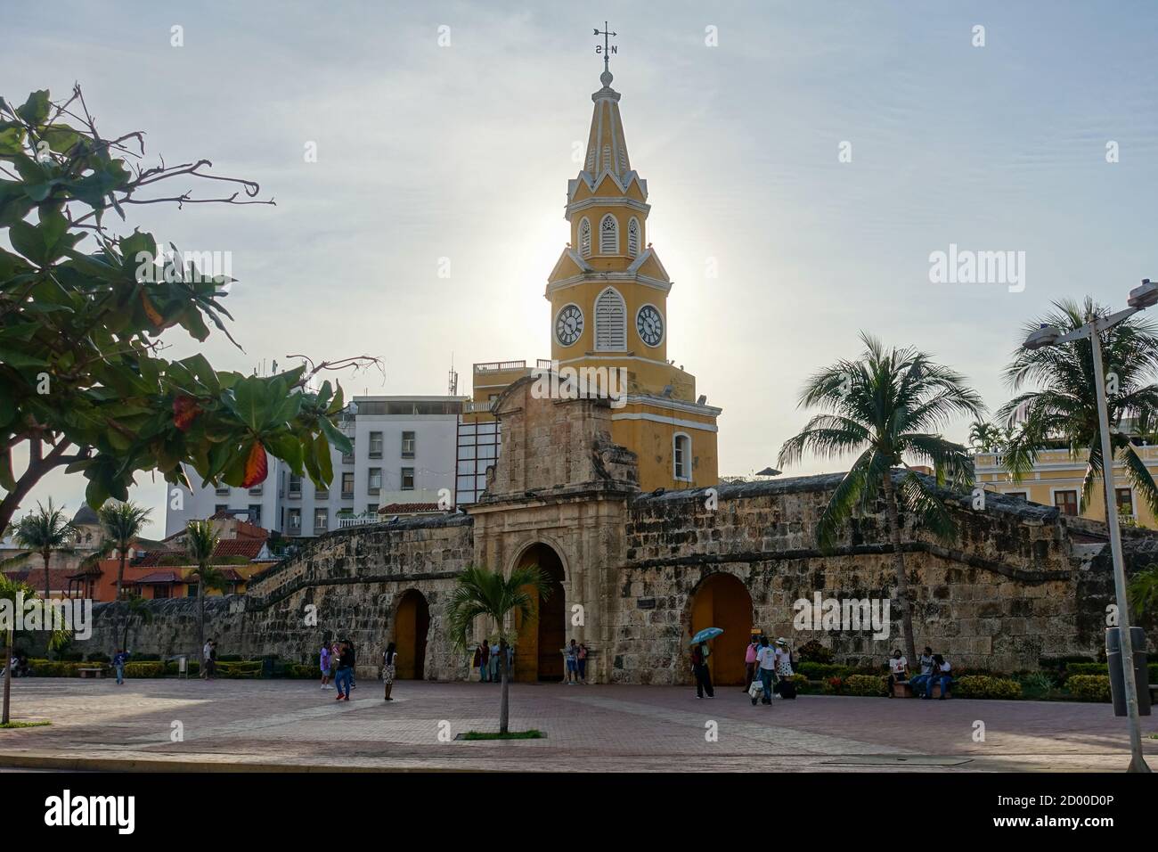 The historic clock tower gate with the setting sun behind, the main ...