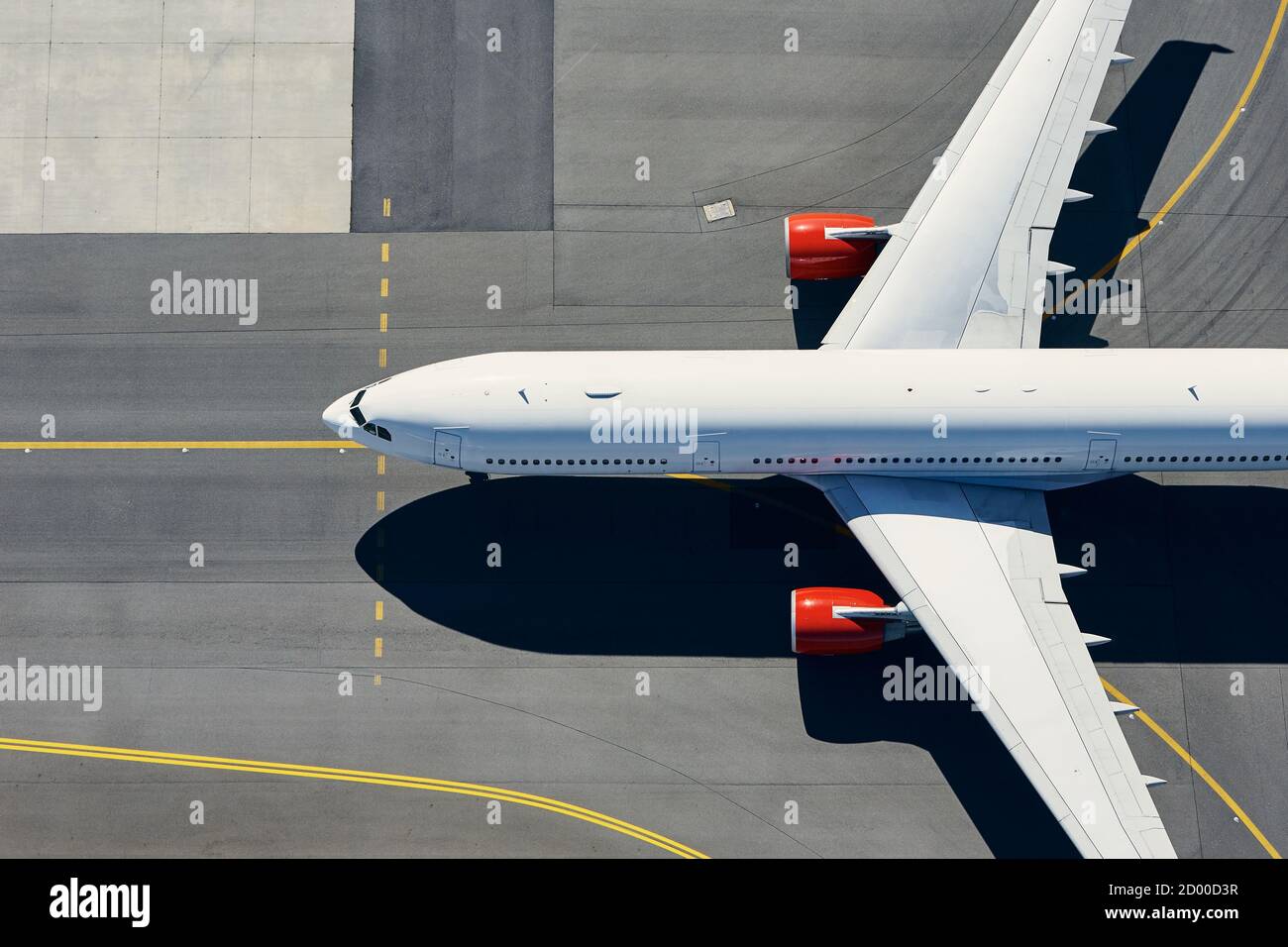 Aerial view of airport. Airplane taxiing to runway before take off ...