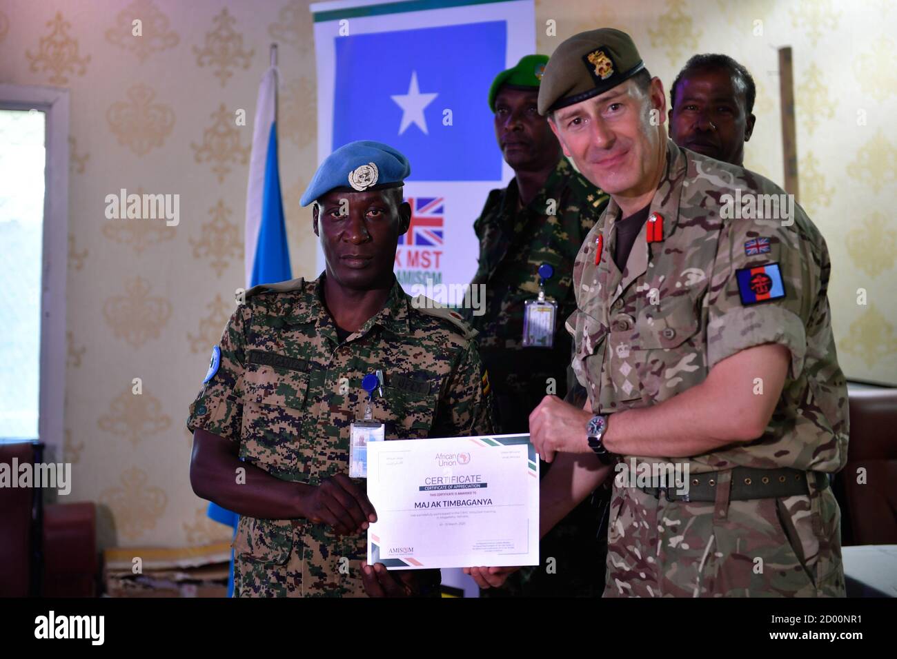 Colonel Tony Casey, Commander of British Forces in Somalia, presents a ...