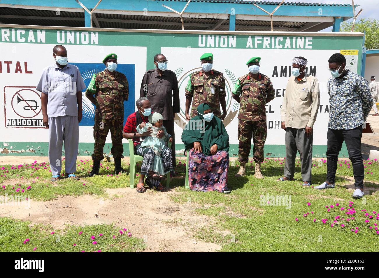 AMISOM officers and Somali officials celebrate the discharge of baby ...