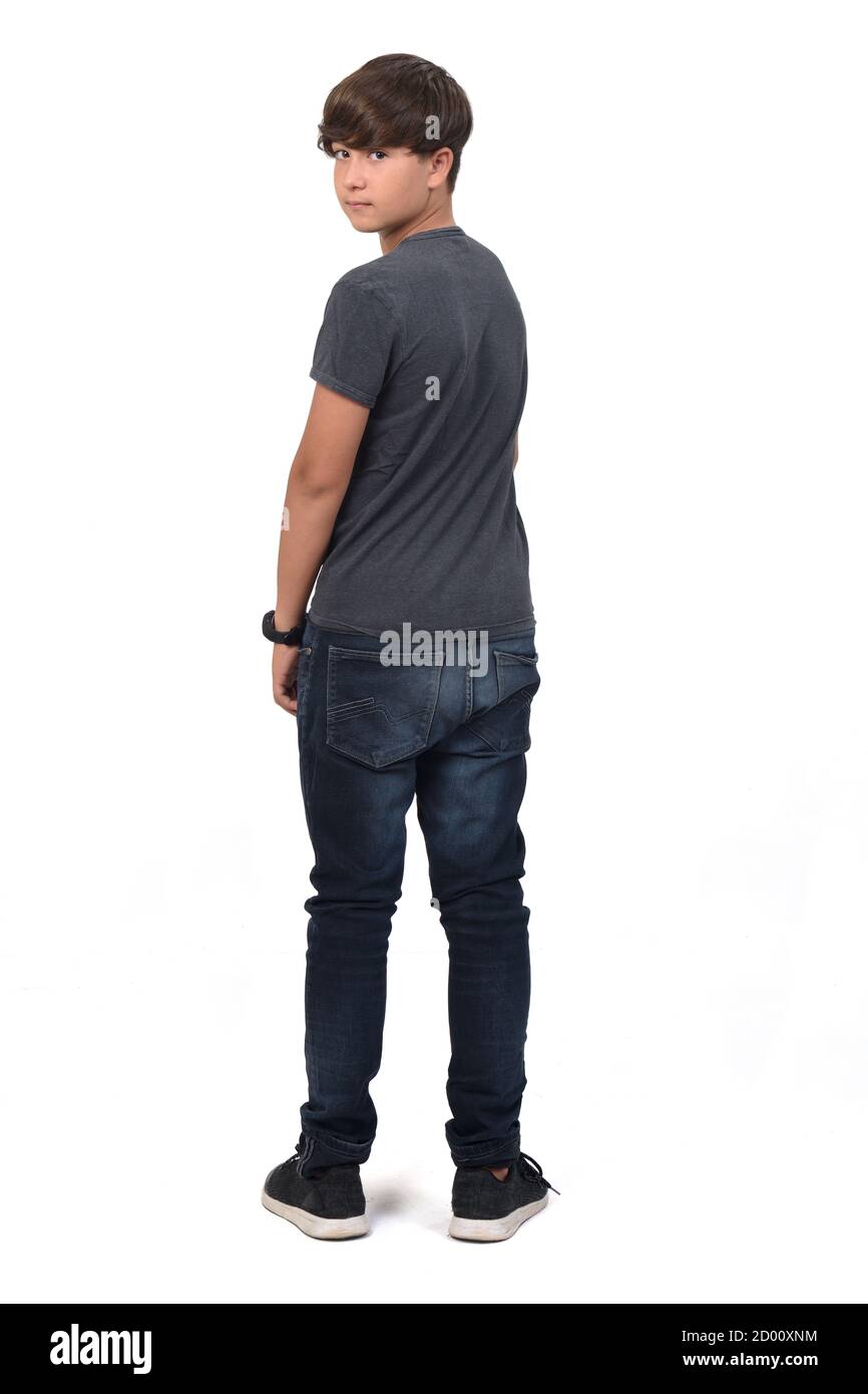 portrait of a teenage boy from behind looking at camera on white ...