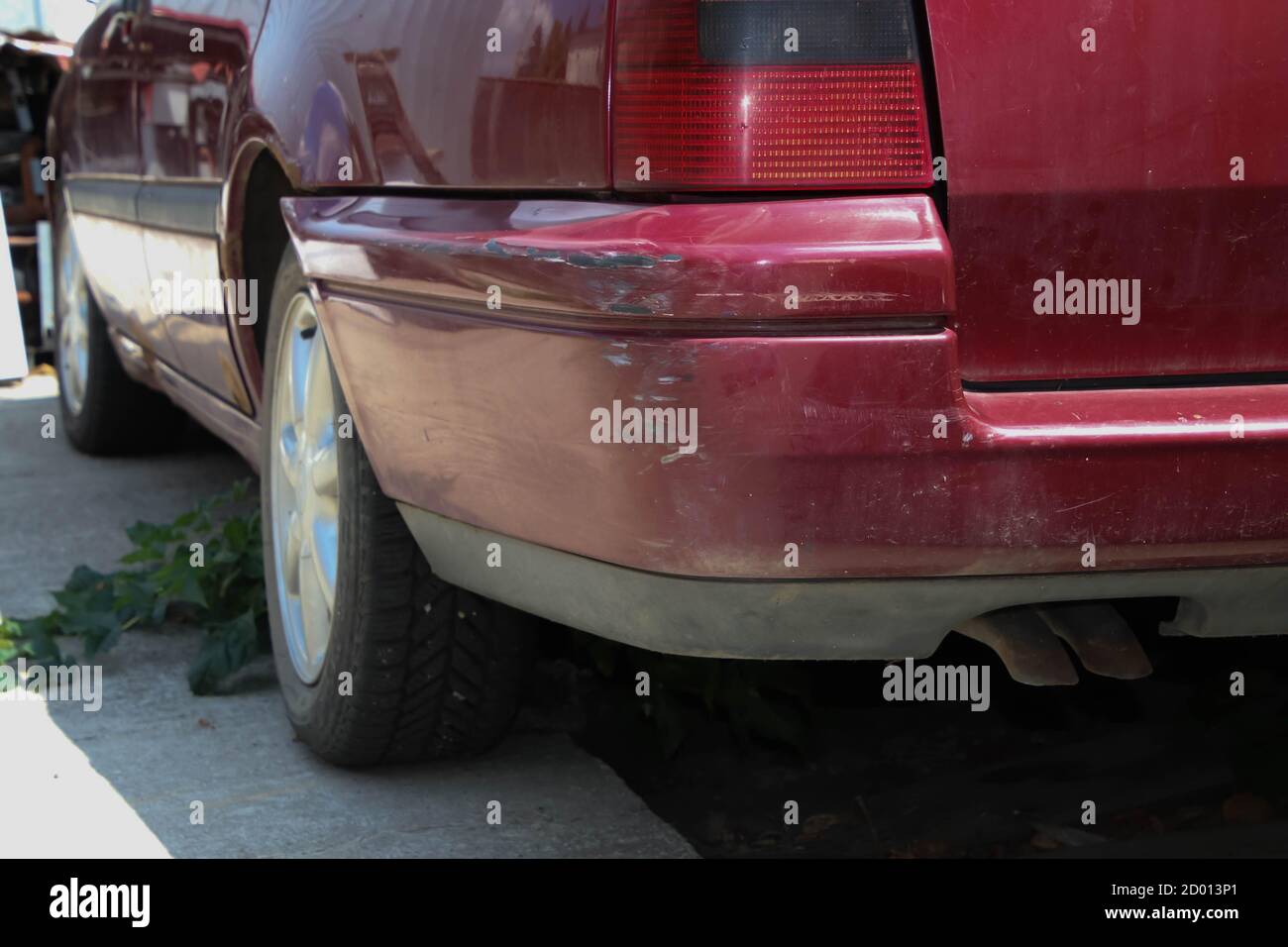 Hit back of an old vintage car. Side view of the burgundy car Stock ...