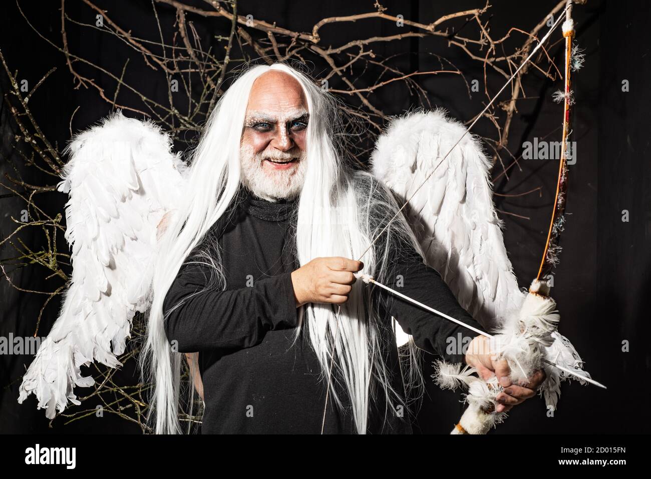 Bearded Man with angel wings. Senior man posing with angel wings. Demon ...