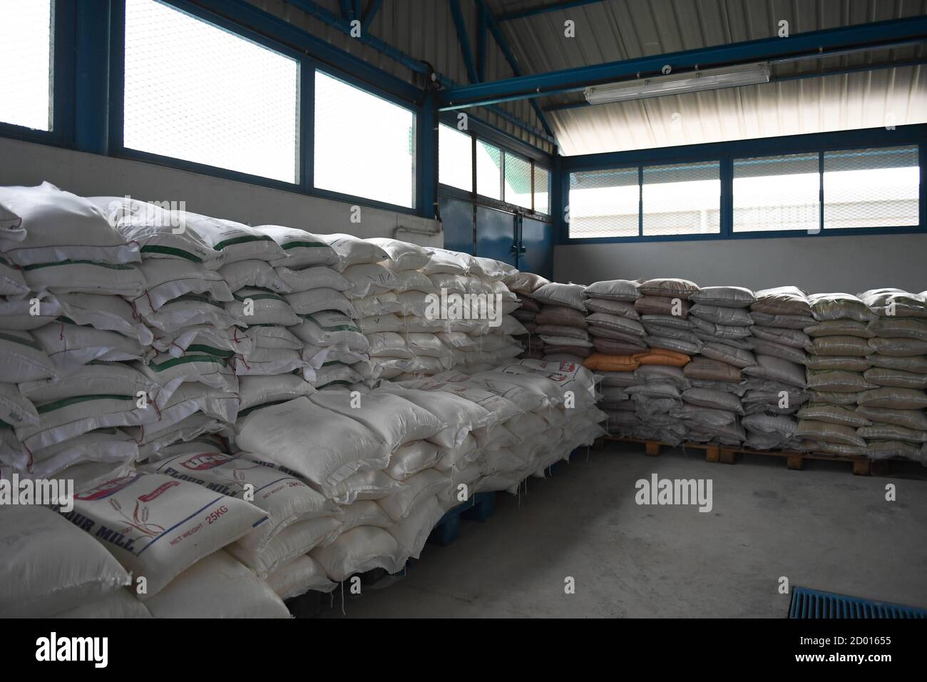 Bags of rice, wheat flour, and sugar donated by the Ugandan contingent ...
