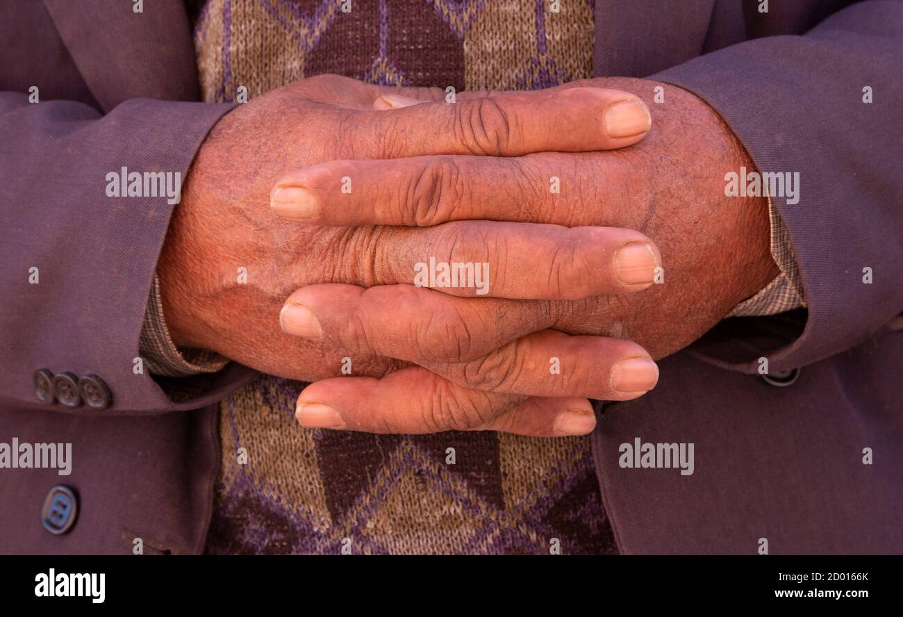 Man hands are folded in peaceful reflection Stock Photo - Alamy