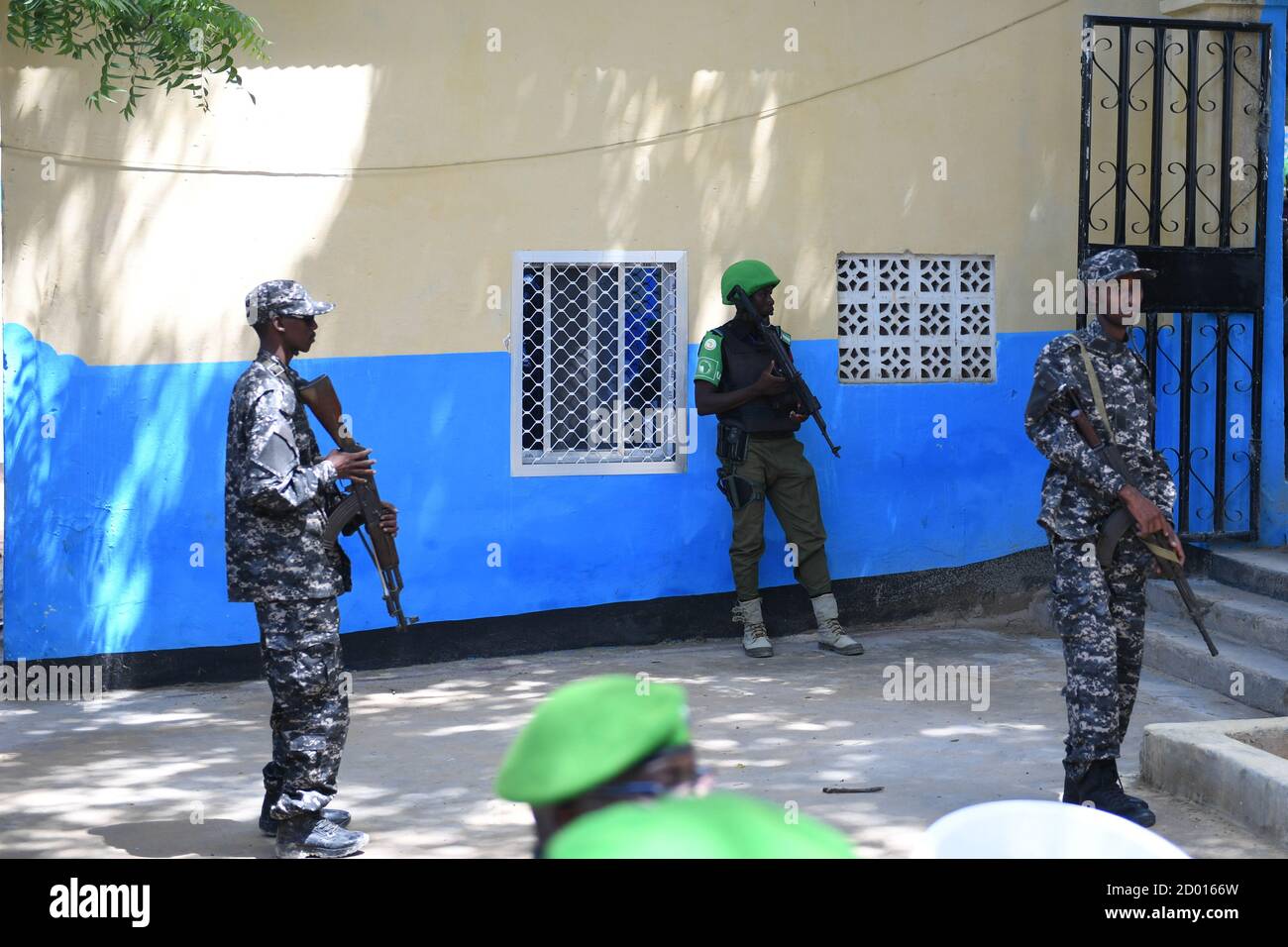 AMISOM Police and Somali soldiers secure the venue during a ceremony on ...