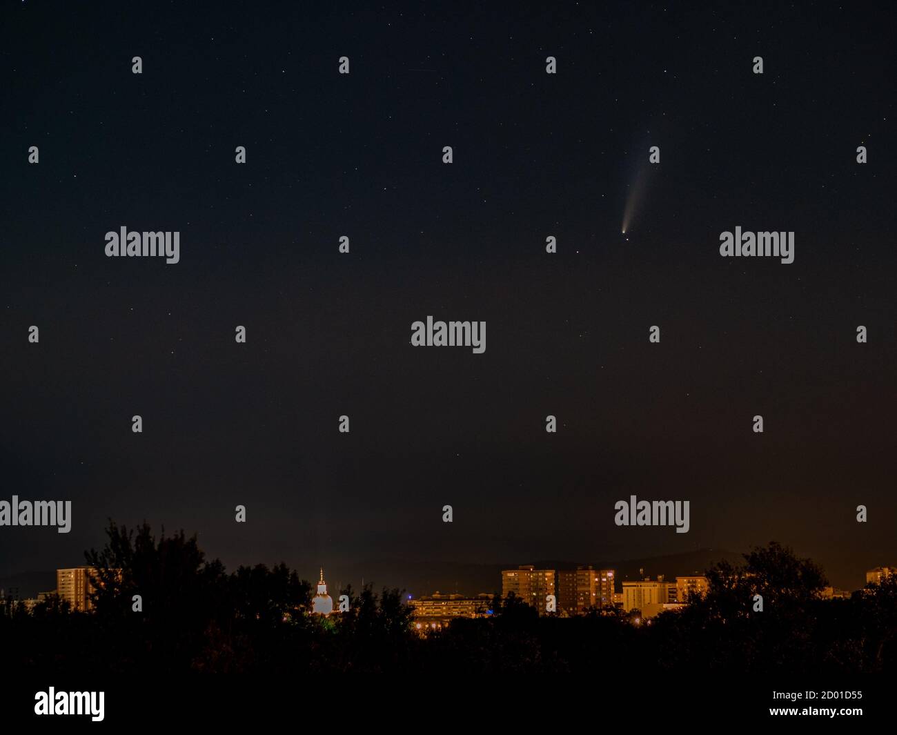 Mesmerizing view of a falling star on the night sky over the city Stock ...