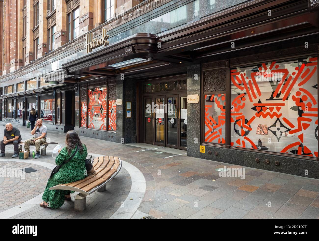 An exterior side view of Harrods department store showing shop window ...