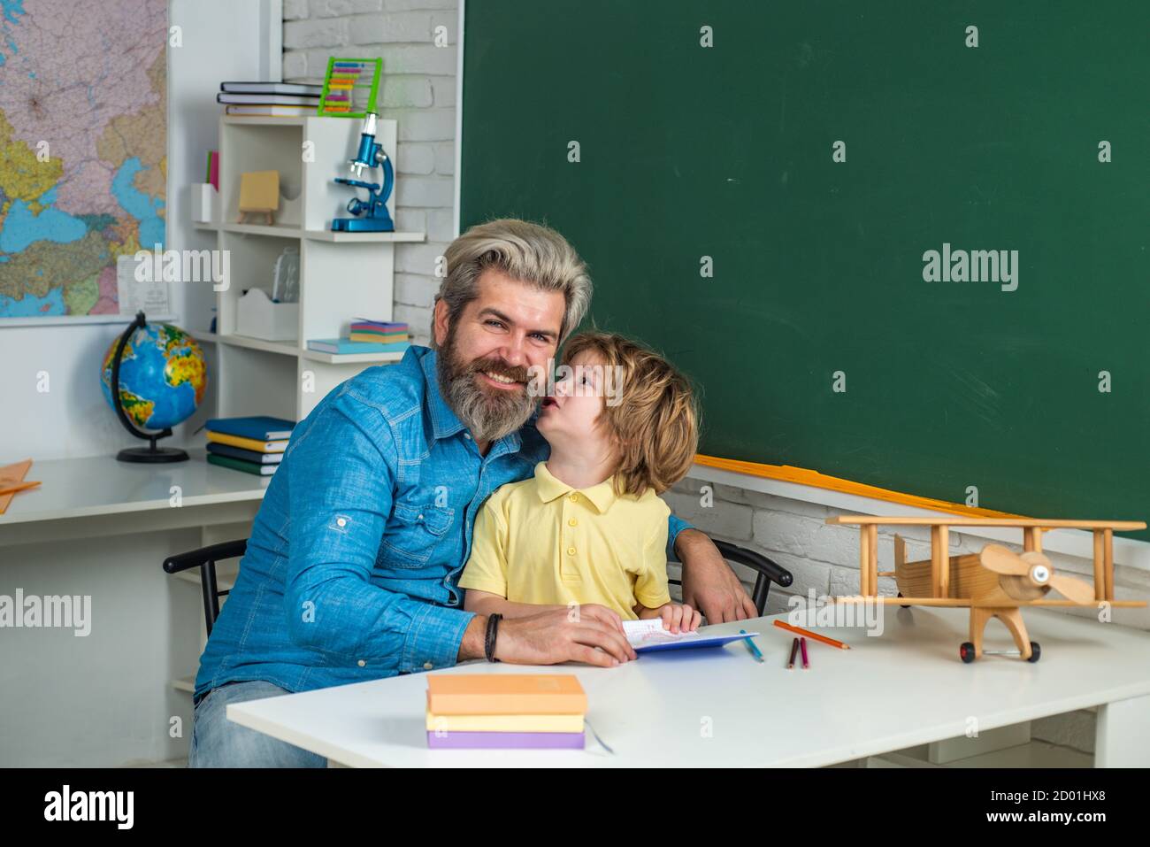 Happy father and son. Back to school. Supporting pupils at school ...
