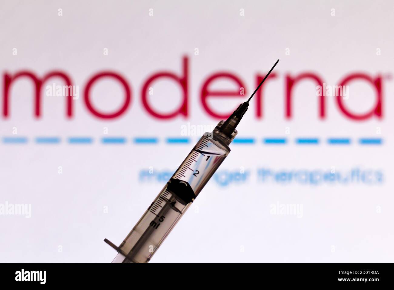 In this photo illustration a medical syringe is seen with Moderna ...