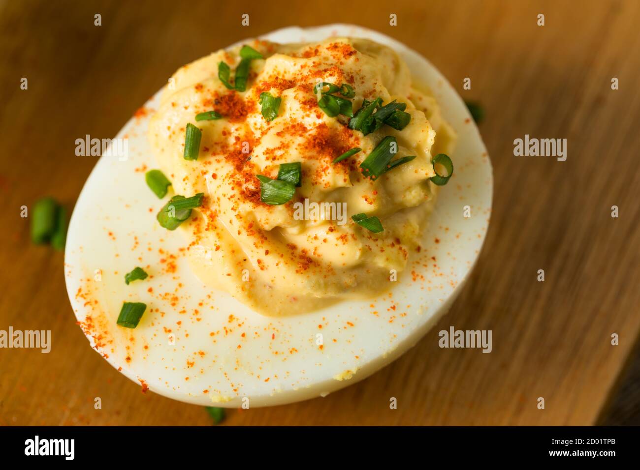 Cooked Organic Hard Boiled Eggs with Chives and Paprika Stock Photo - Alamy