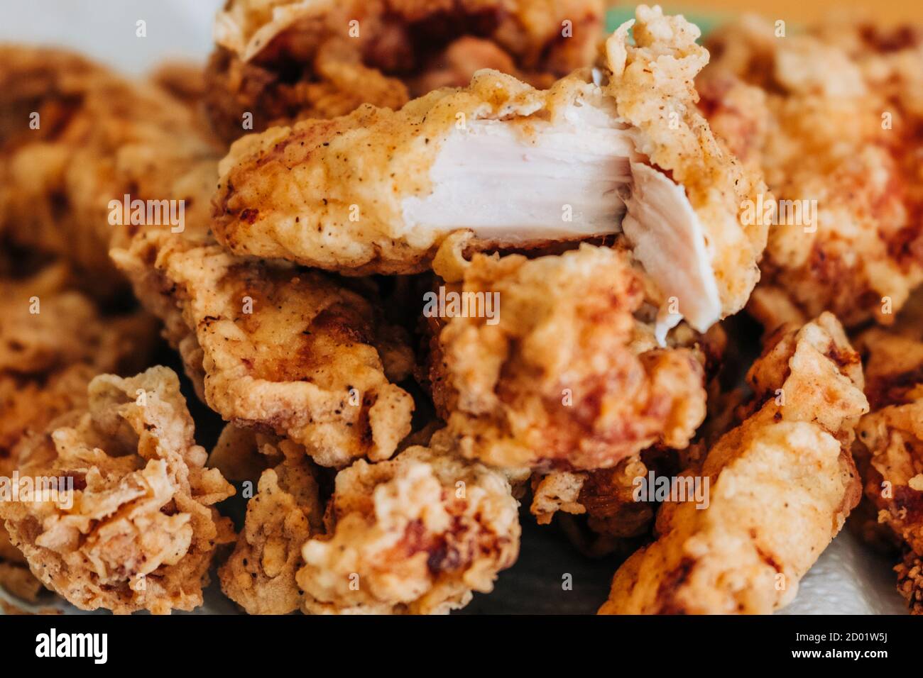 Delicious looking fried chicken split open Stock Photo - Alamy