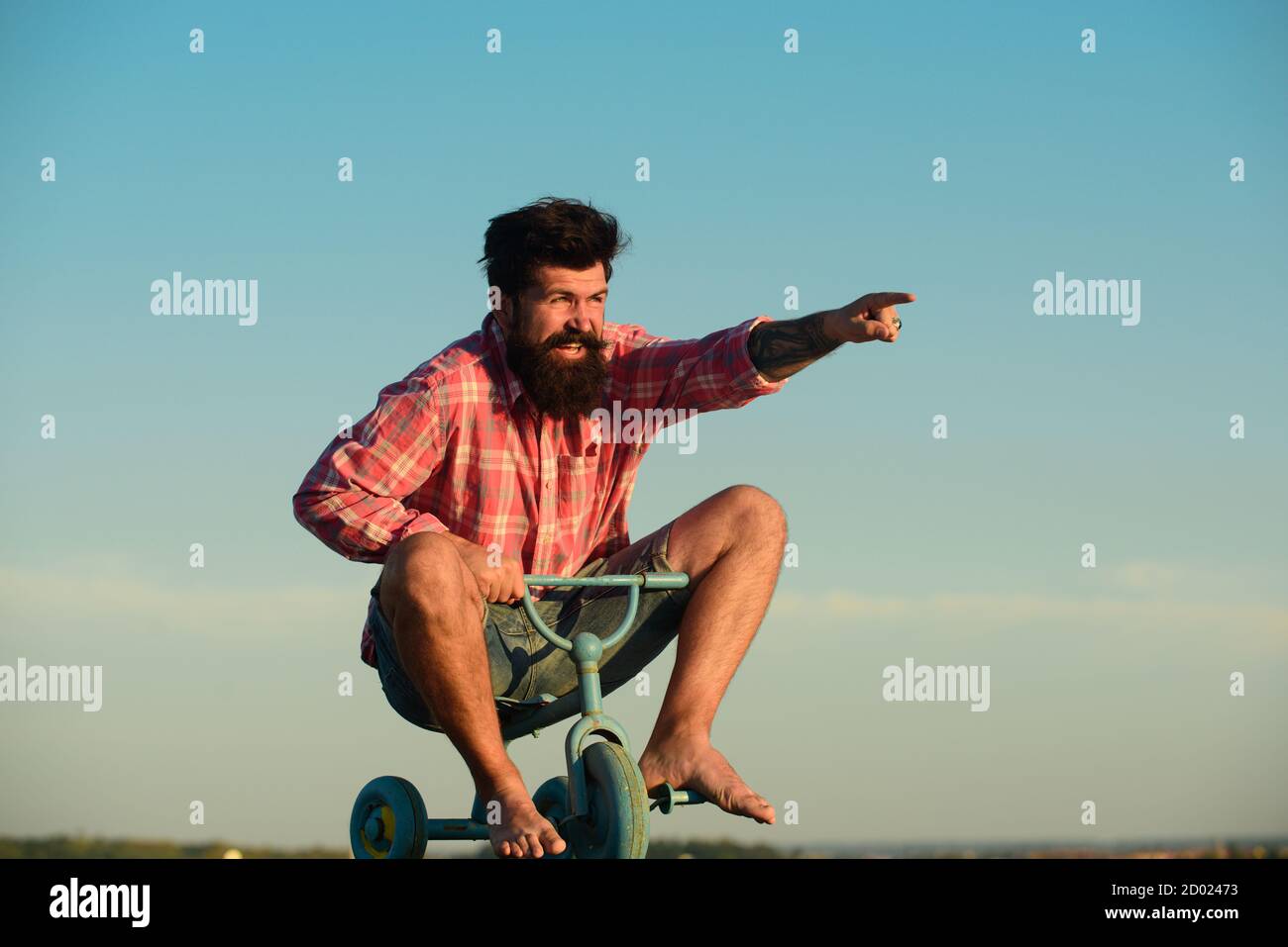 Crazy young man riding a small bike hi-res stock photography and images ...