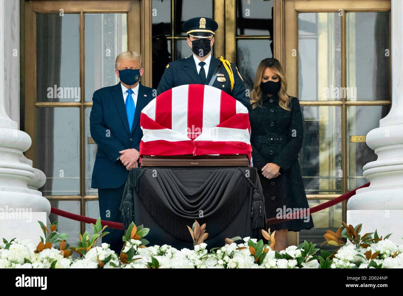 U.S. President Donald Trump and First Lady Melania Trump pay respects ...