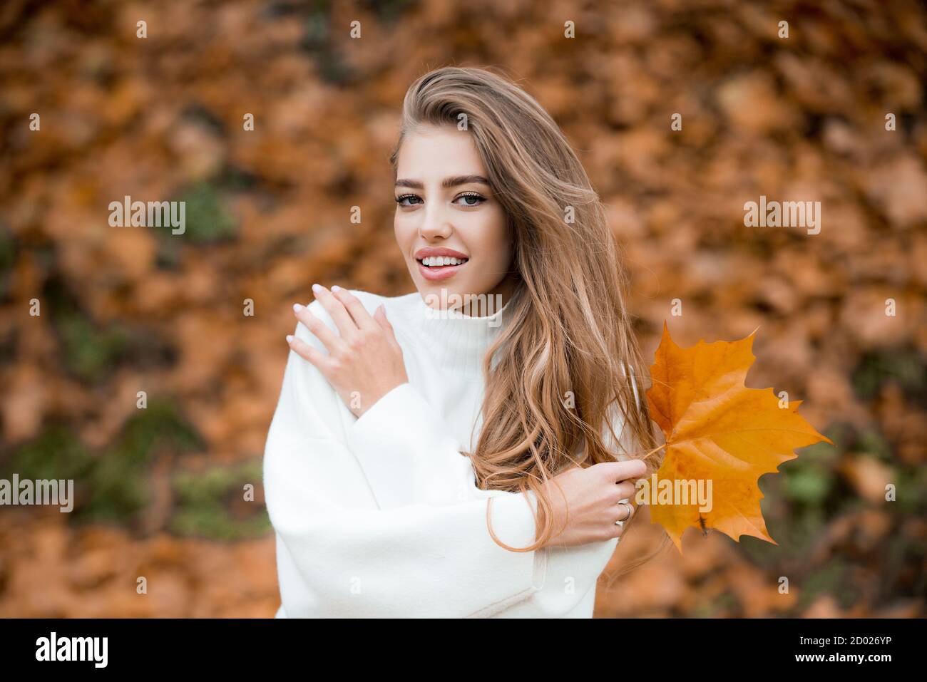 Autumn trend. Beautiful woman fashion model having fun in fall park outdoors Stock Photo - Alamy