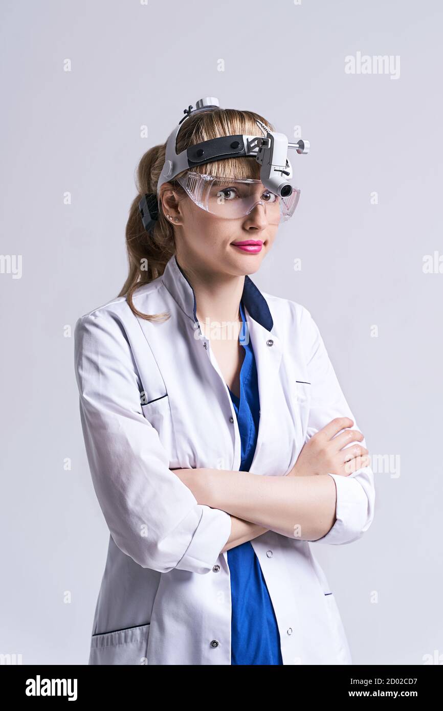 Confident ENT doctor wearing surgical headlight head light and ...