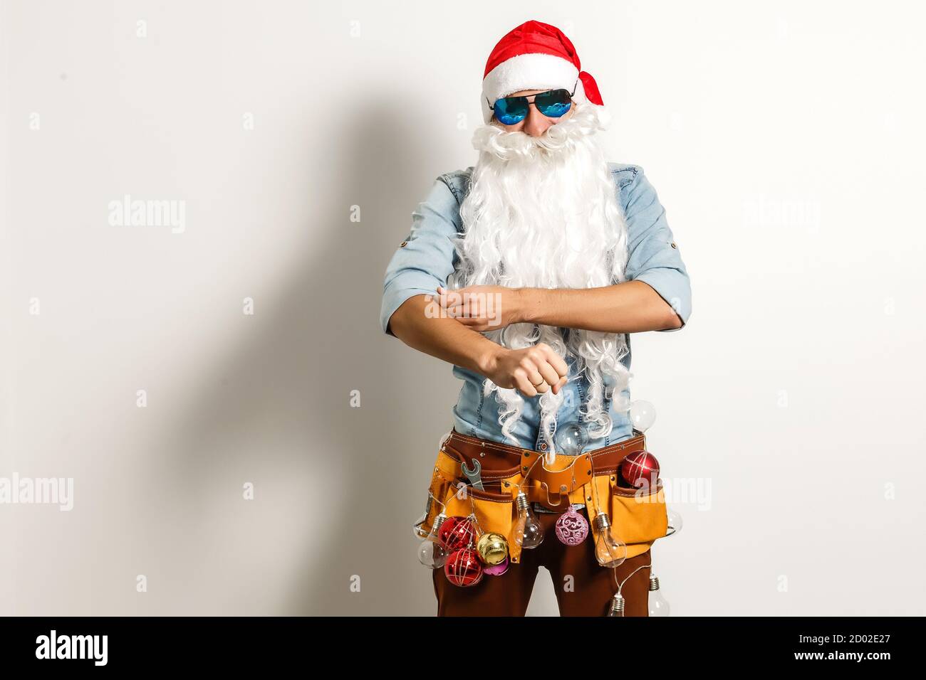 Santa with construction tools, santa repairman Stock Photo - Alamy