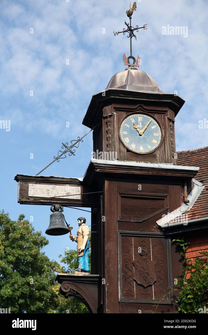 Abinger Hammer Clock overhangs the main road and portrays the figure of ...