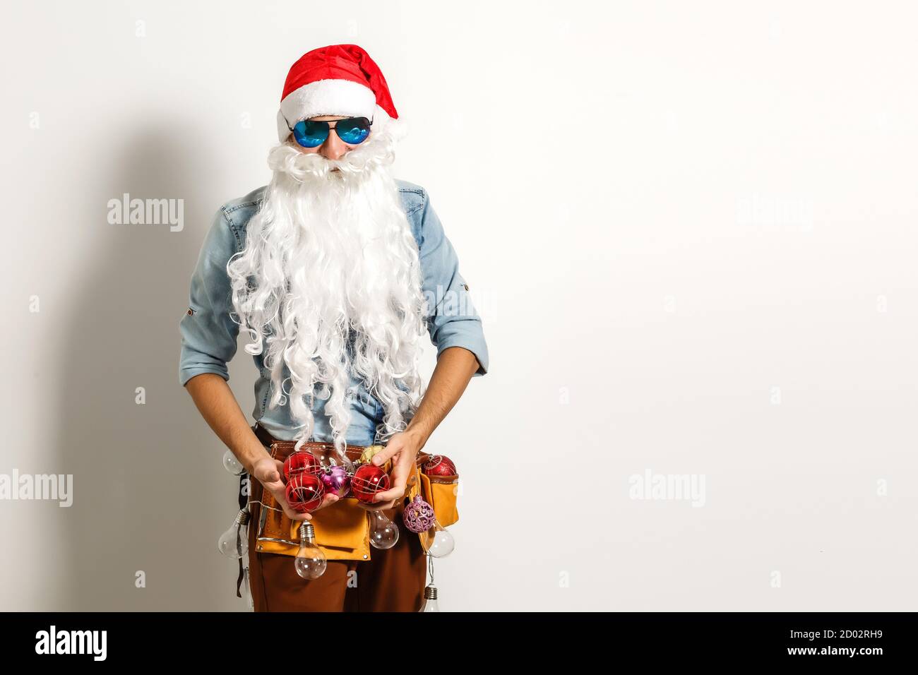 Santa with construction tools, santa repairman Stock Photo - Alamy