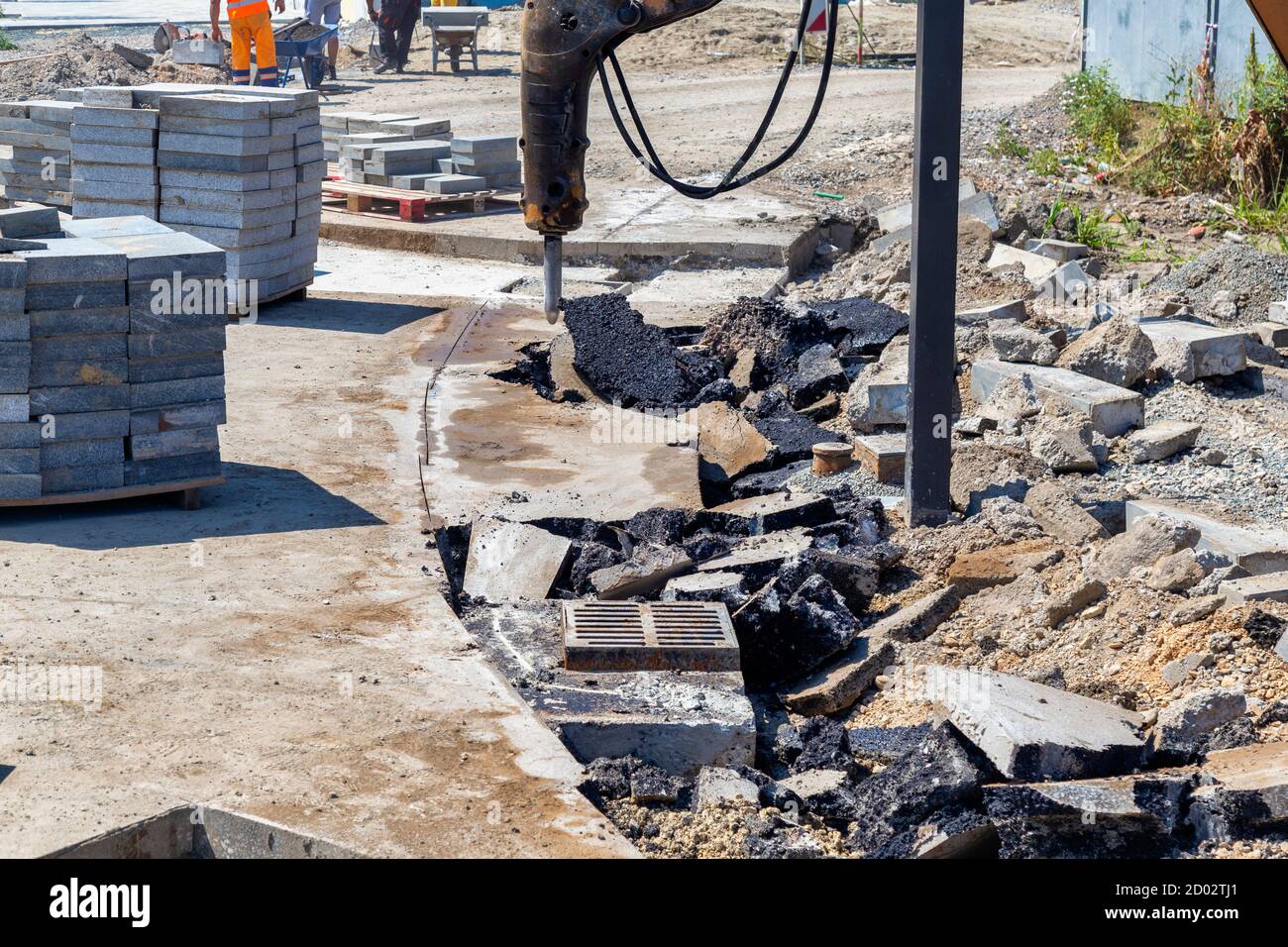 Asphalt pavement repairing works with jackhammer, breaking asphalt ...