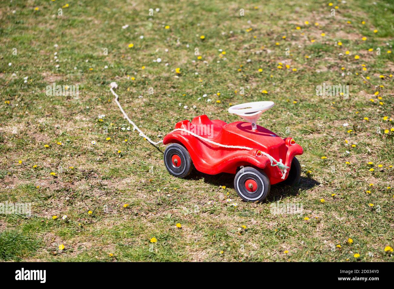 Little toy car for children on the grass field, outdoor summer ...