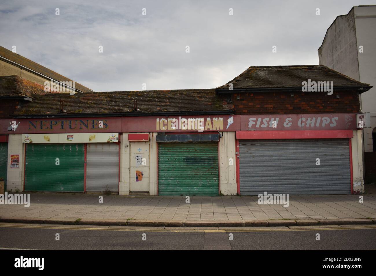 Closed shops in a seaside town in England, with shutters down Stock ...