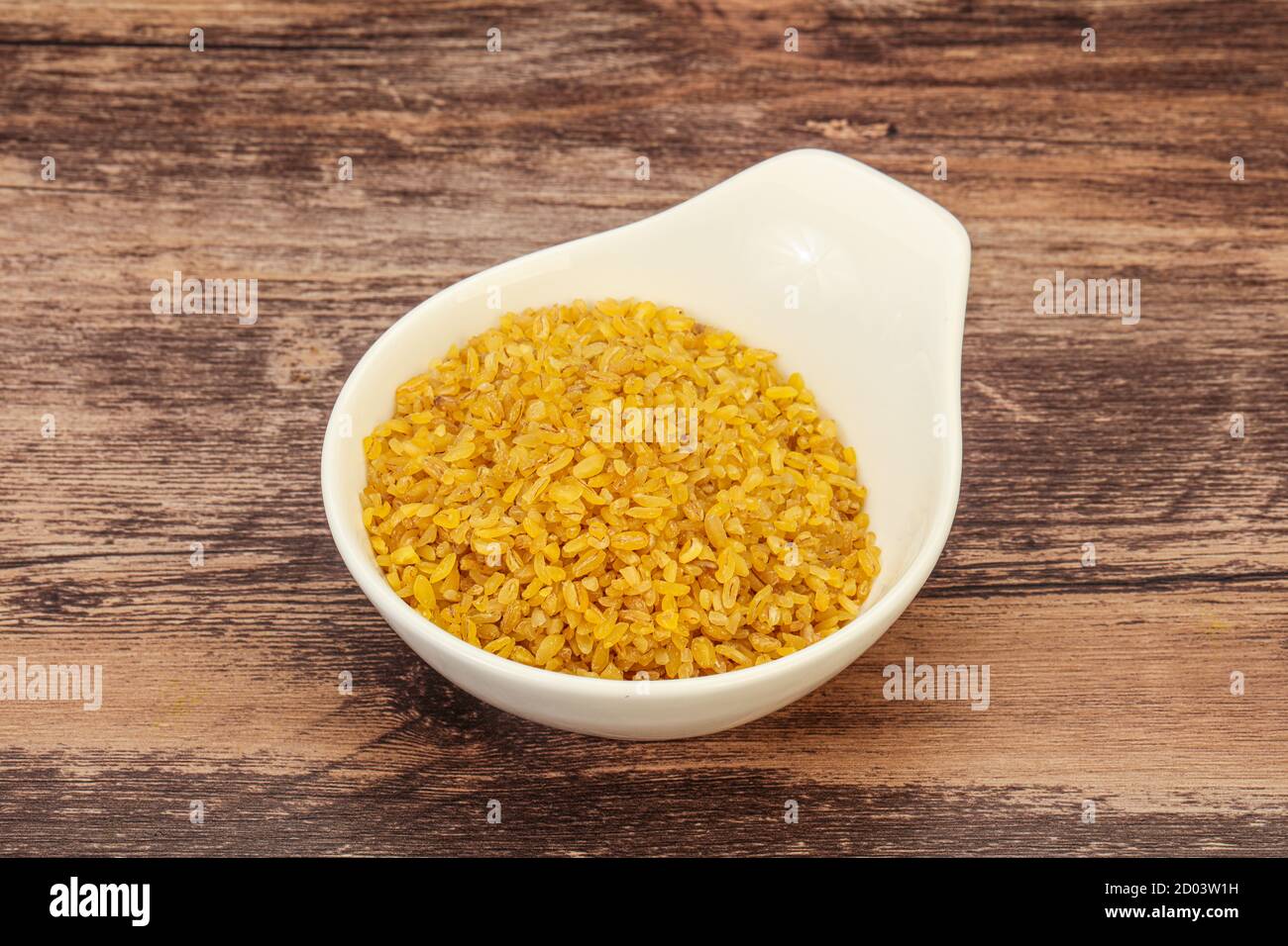 Vegetarian cuisine - dry bulgur for cooking in the bowl Stock Photo - Alamy