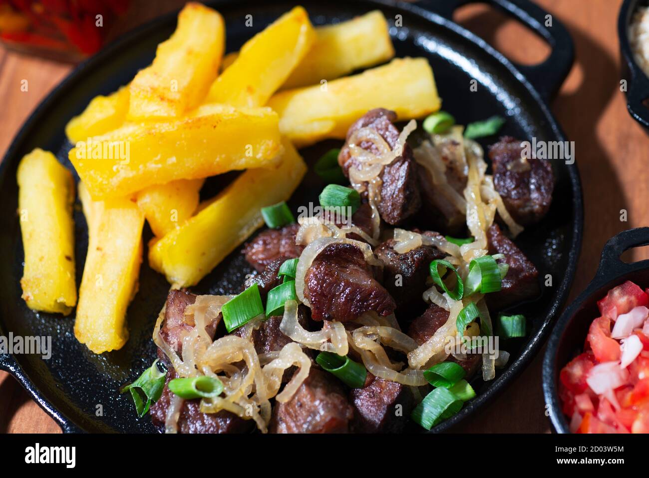 typical local food, fried meat with onions and cassava, Brazil Stock ...