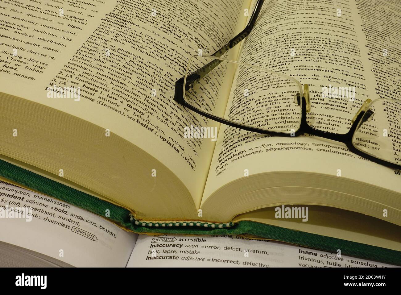 Closeup shot of glasses on an open dictionary Stock Photo - Alamy