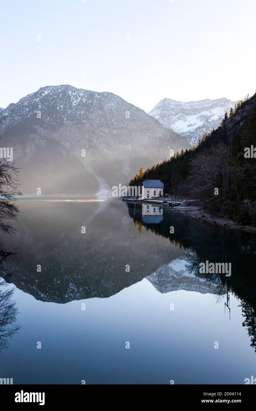 Winter reflection on a austrian lake Stock Photo - Alamy