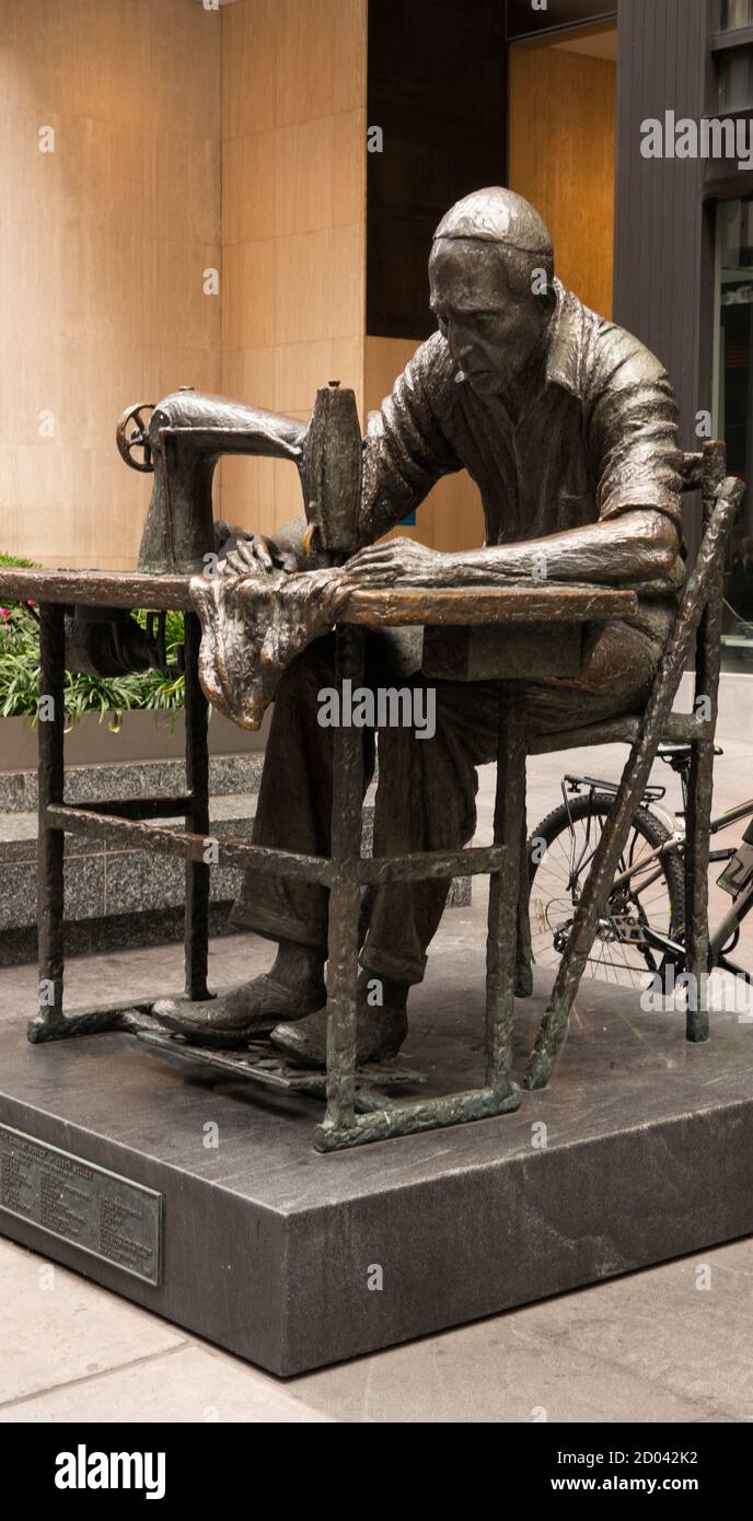 Garment worker sculpture on seventh avenue in Manhattan NYC Stock Photo ...