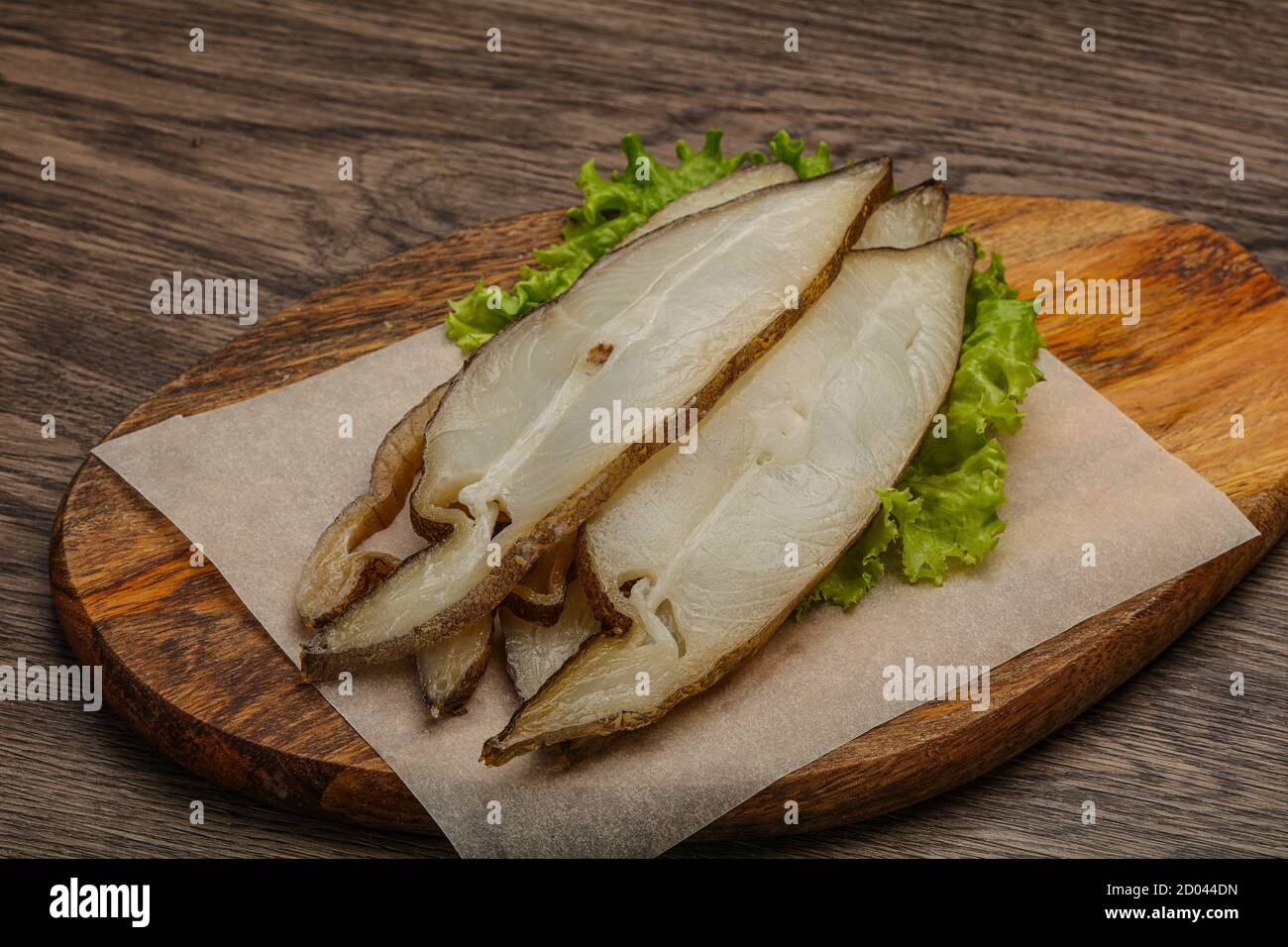 Delicous smoked halibut fish slices snack Stock Photo - Alamy